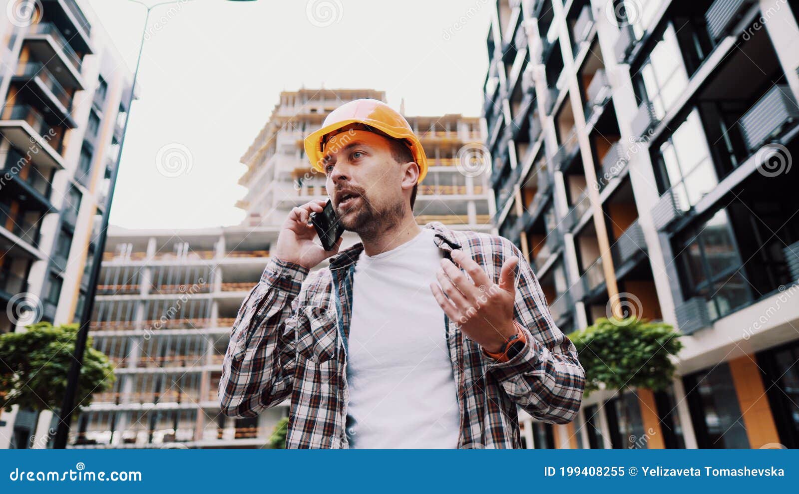 Engineer Talking on Phone. Architect Using Phone on Construction Site ...