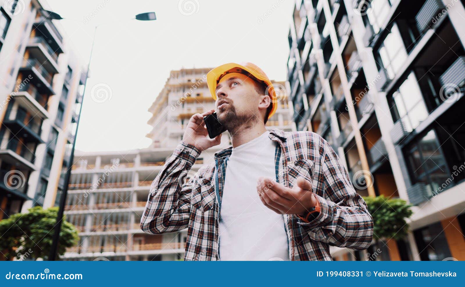 Engineer Talking on Phone. Architect Using Phone on Construction Site ...