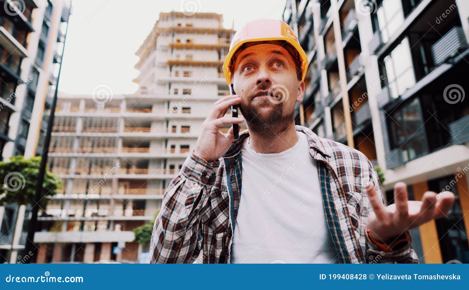 Engineer Talking on Phone. Architect Using Phone on Construction Site ...
