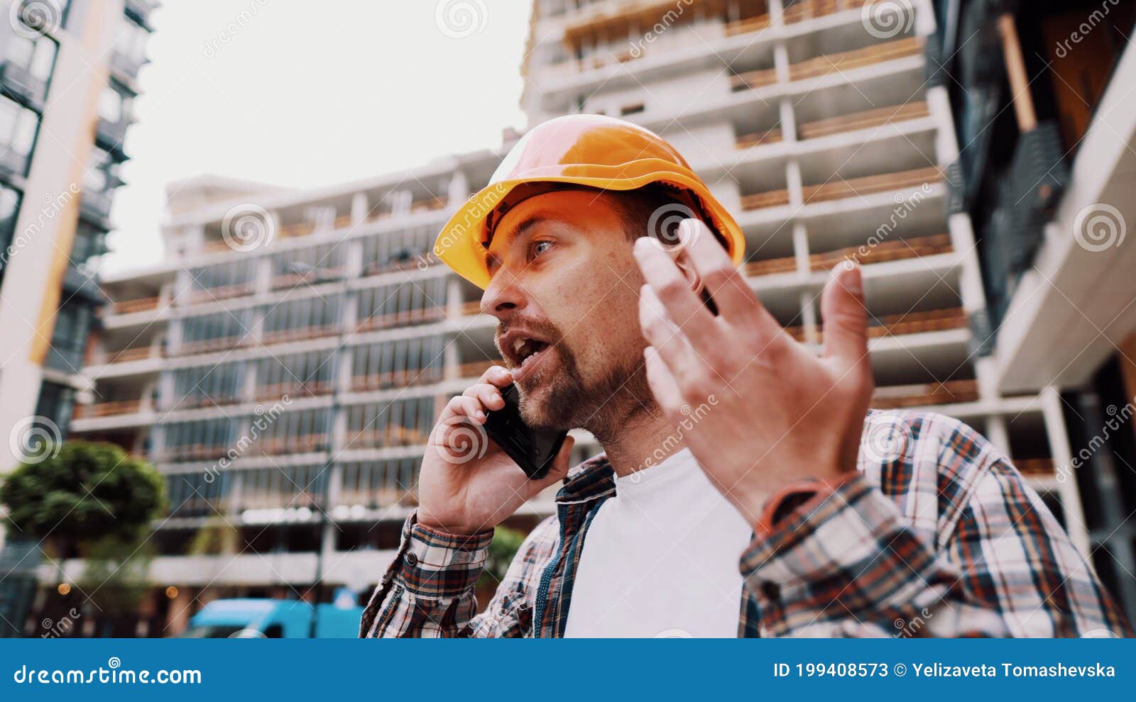 Engineer Talking on Phone. Architect Using Phone on Construction Site ...