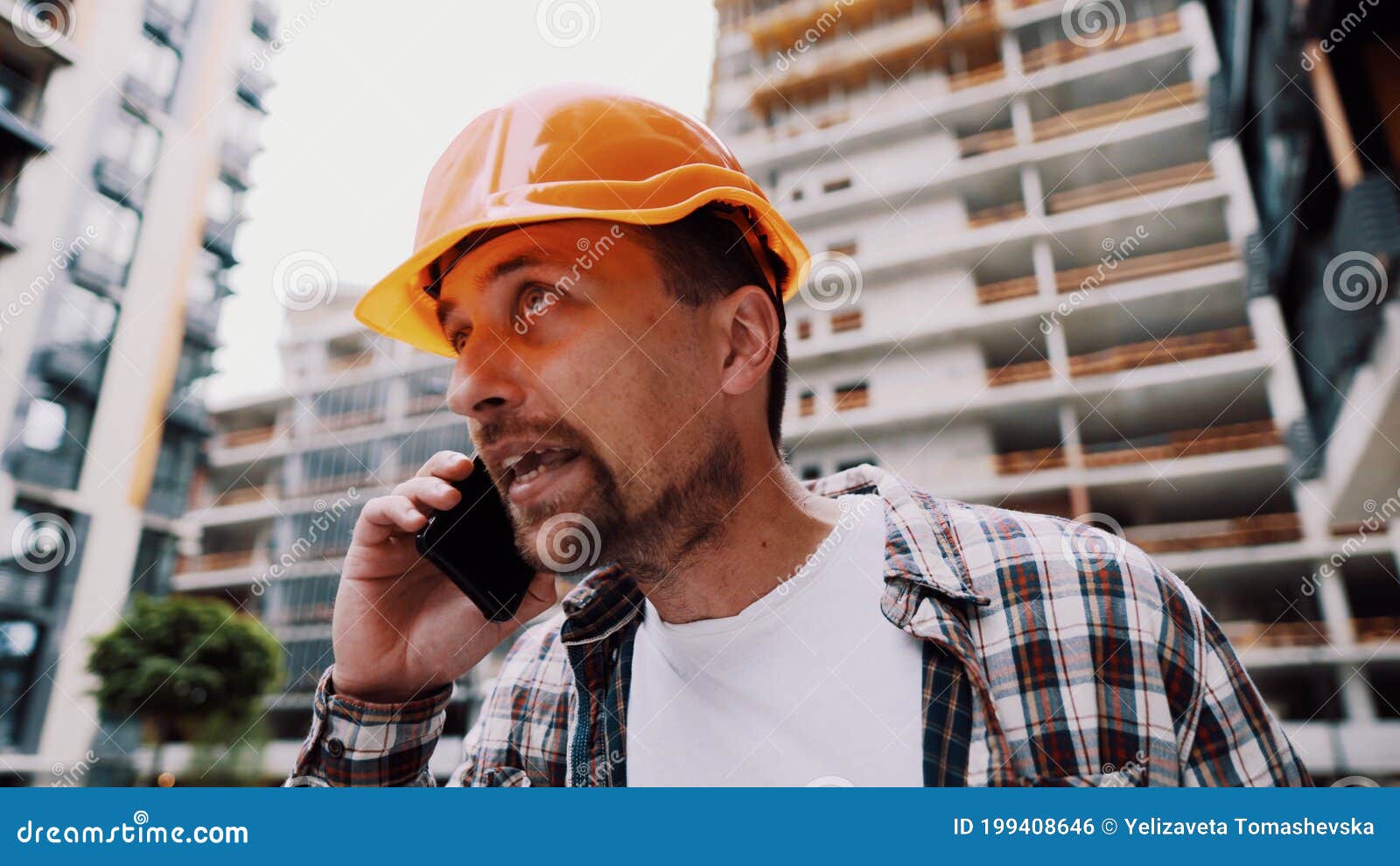 Engineer Talking on Phone. Architect Using Phone on Construction Site ...