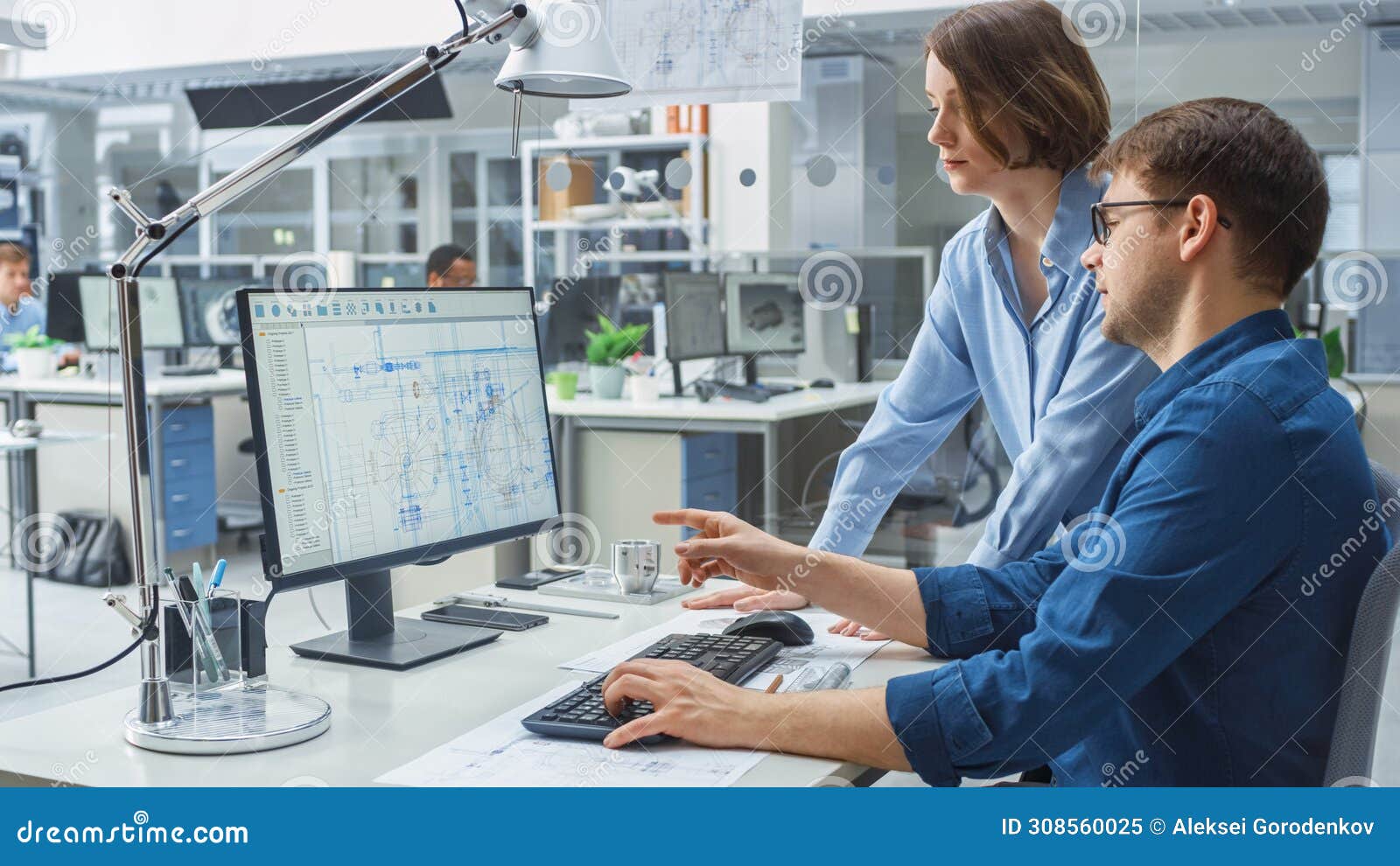 Engineer Talking with Project Manager and Working on Desktop Computer ...