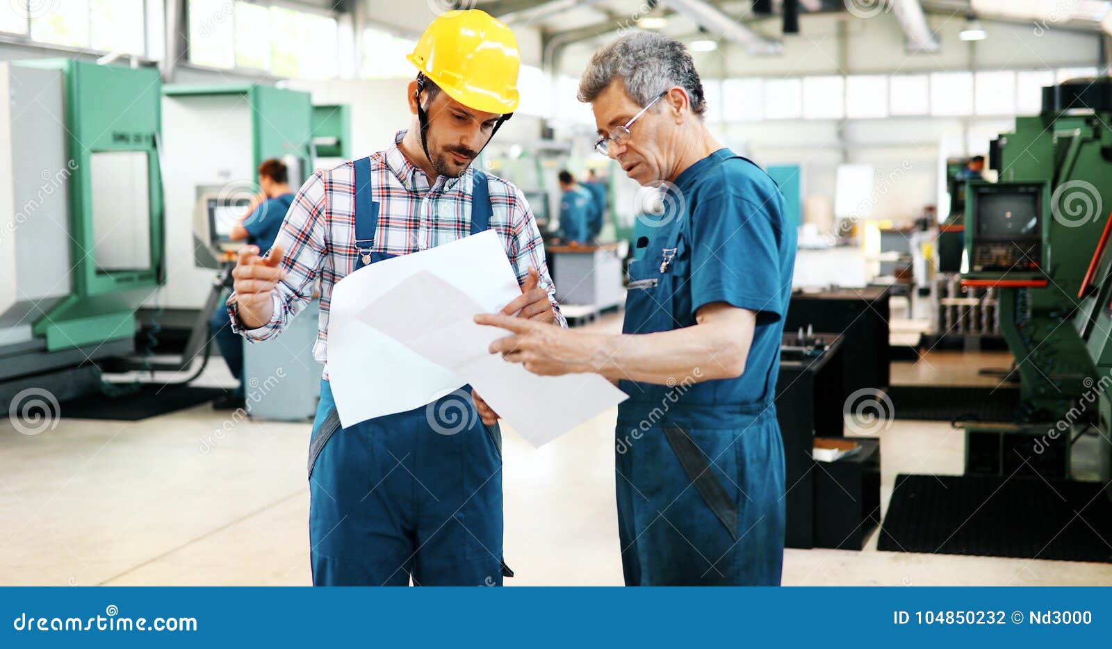 Engineer Teaching Apprentices To Use Computerized Cnc Metal Processing ...