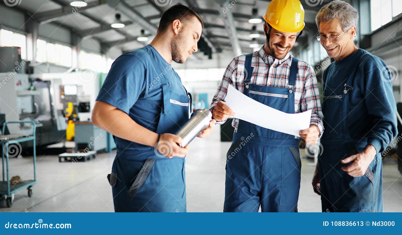 Engineer Teaching Apprentices To Use Computerized Cnc Metal Processing ...
