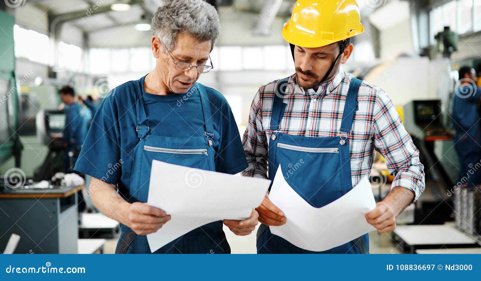 Engineer Teaching Apprentices To Use Computerized Cnc Metal Processing ...