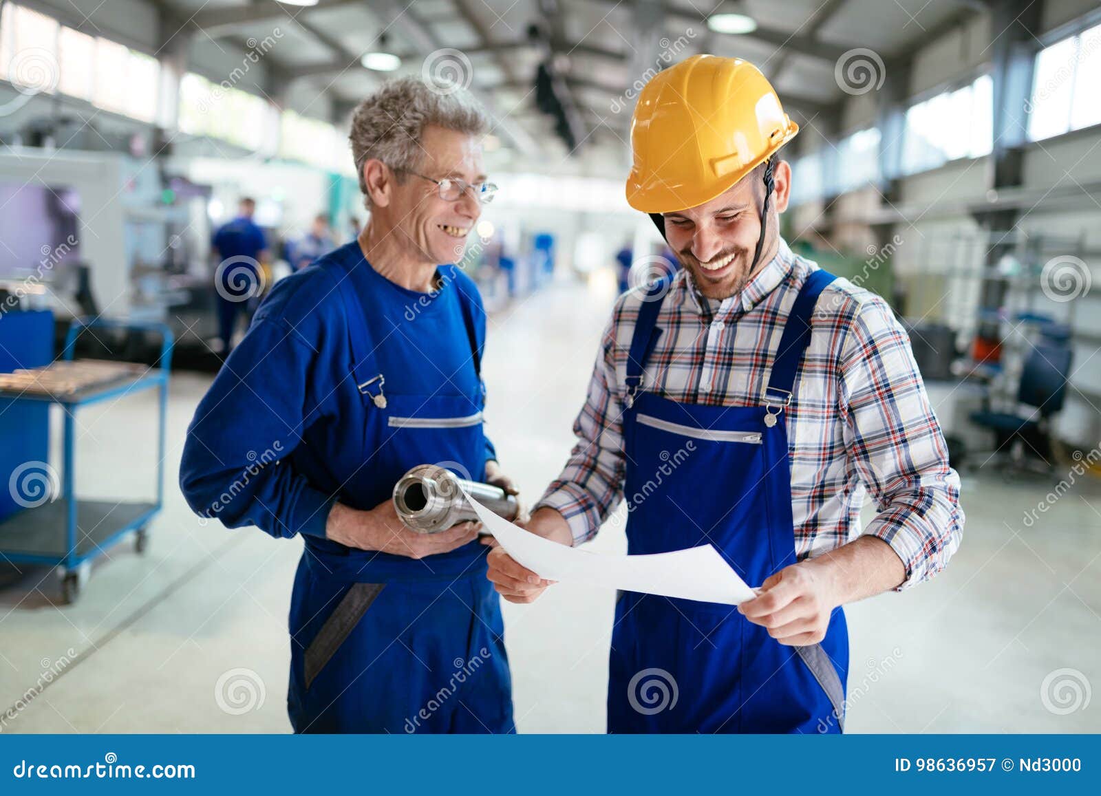 Engineer Teaching Apprentices To Use Computerized Cnc Metal Processing ...