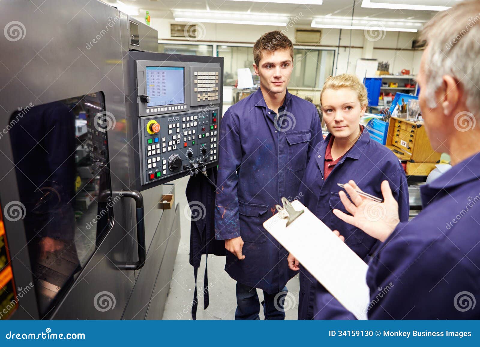 Engineer Teaching Apprentices To Use Computerized Lathe Stock Photo ...
