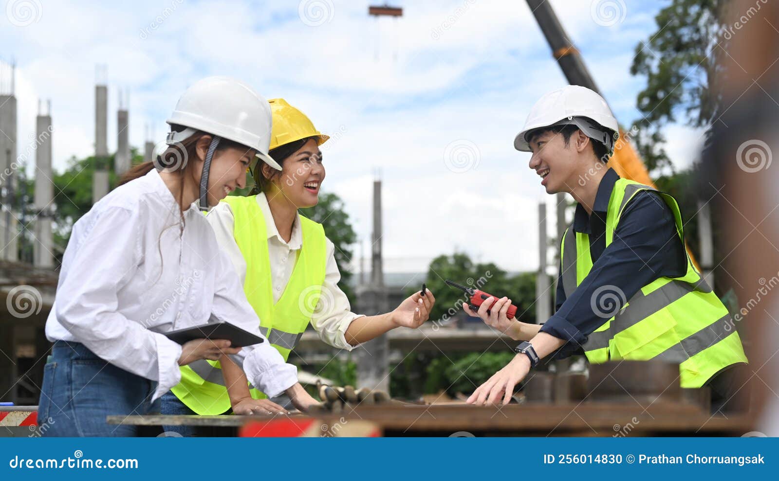 Engineer Team in Safety Helmet and Reflective Jackets are Planning ...