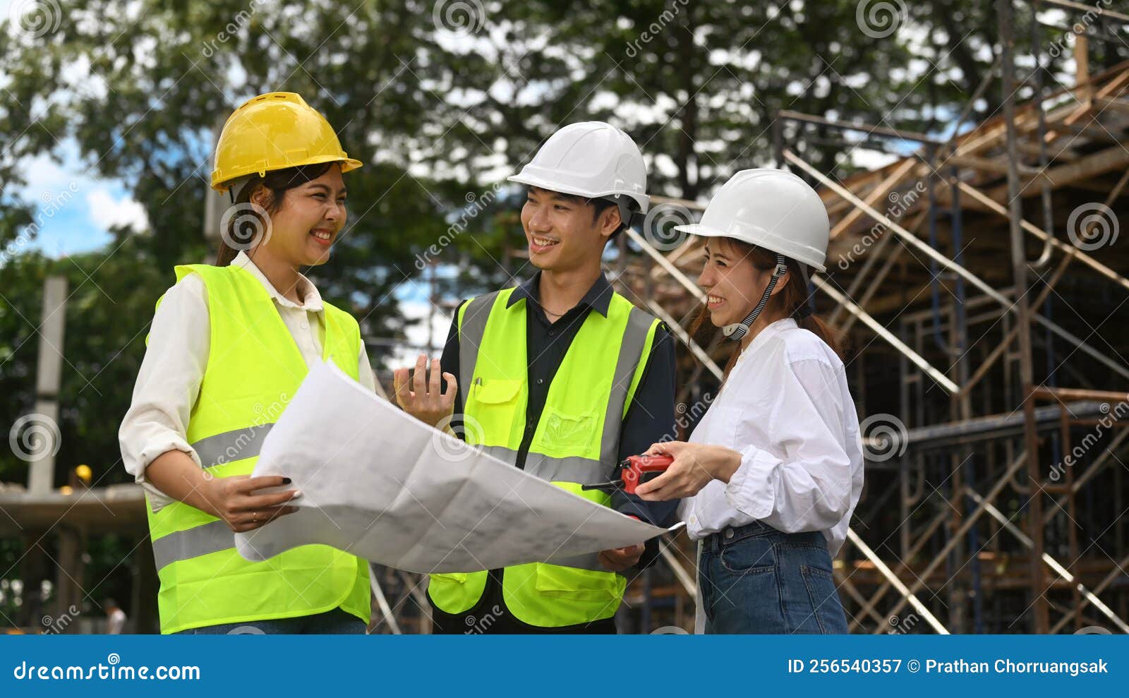 Engineer Team in Safety Helmet and Reflective Jackets Supervising ...