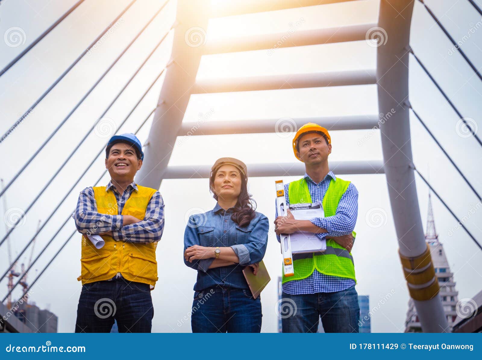 Engineer Team Work In Town.They Are Embrace And See Building. Stock ...