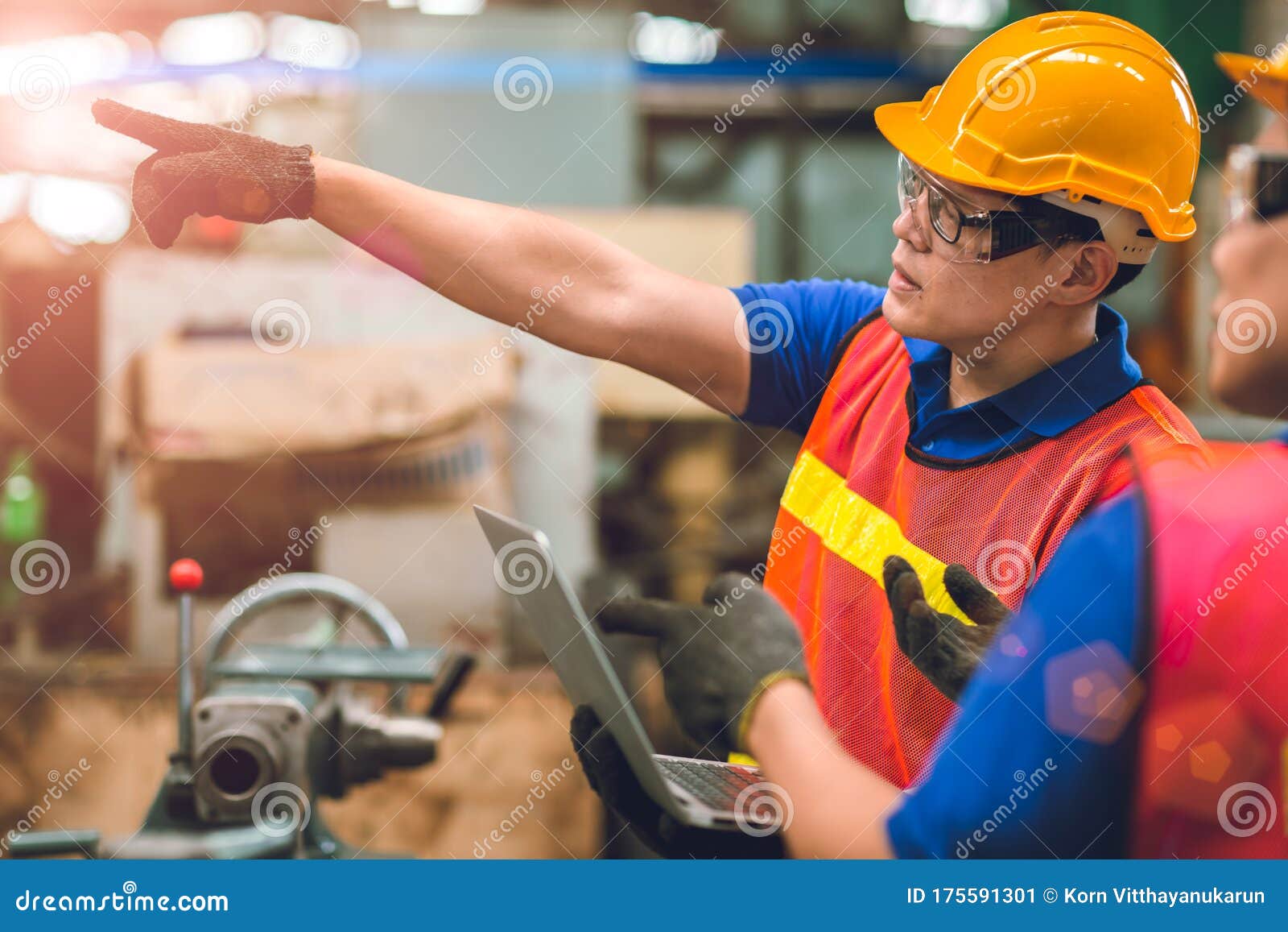 Engineer Team Working Together in Heavy Industry with Laptop Computer ...
