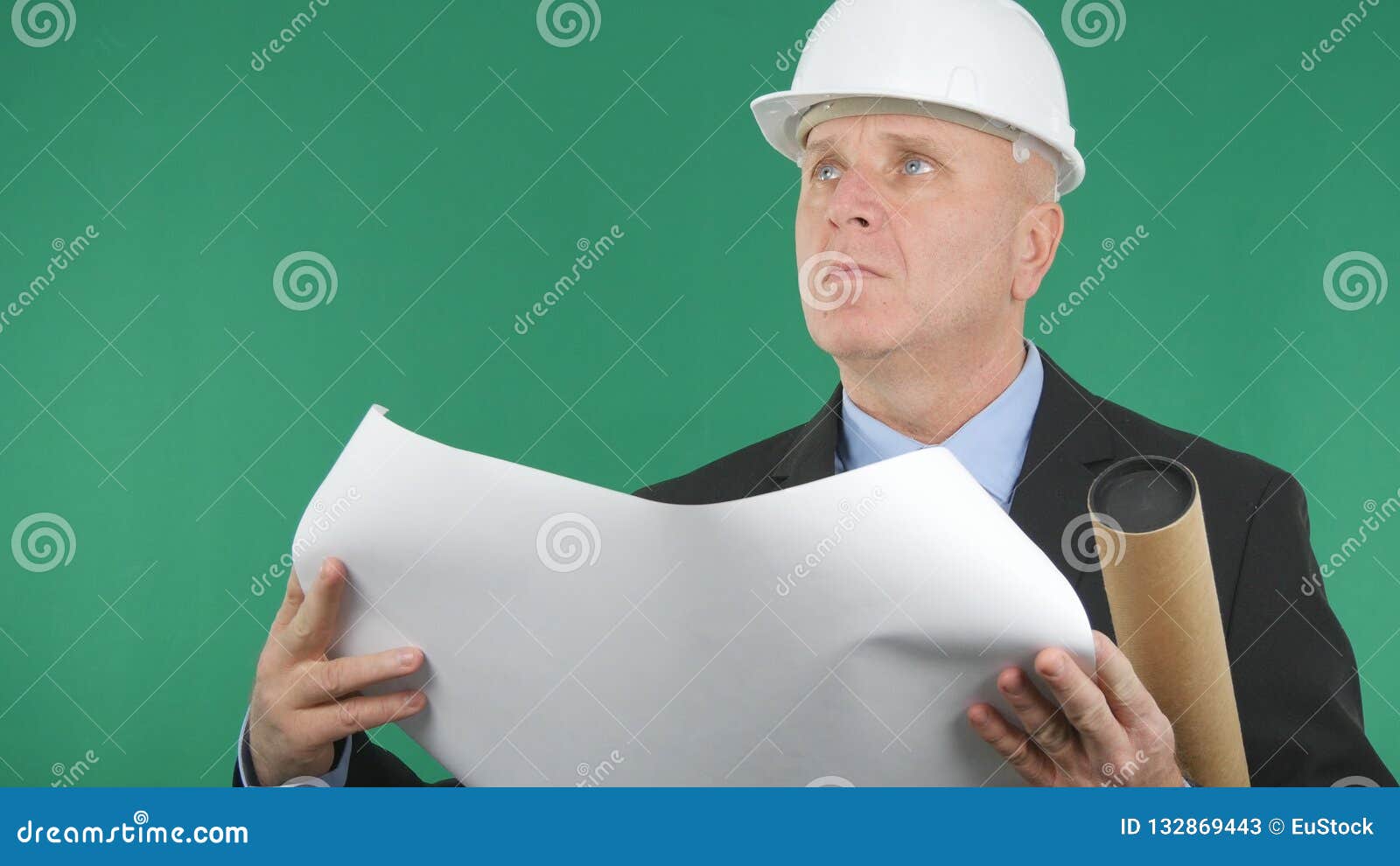 Engineer with Technical Project Open in Hands Looking Up Stock Image ...