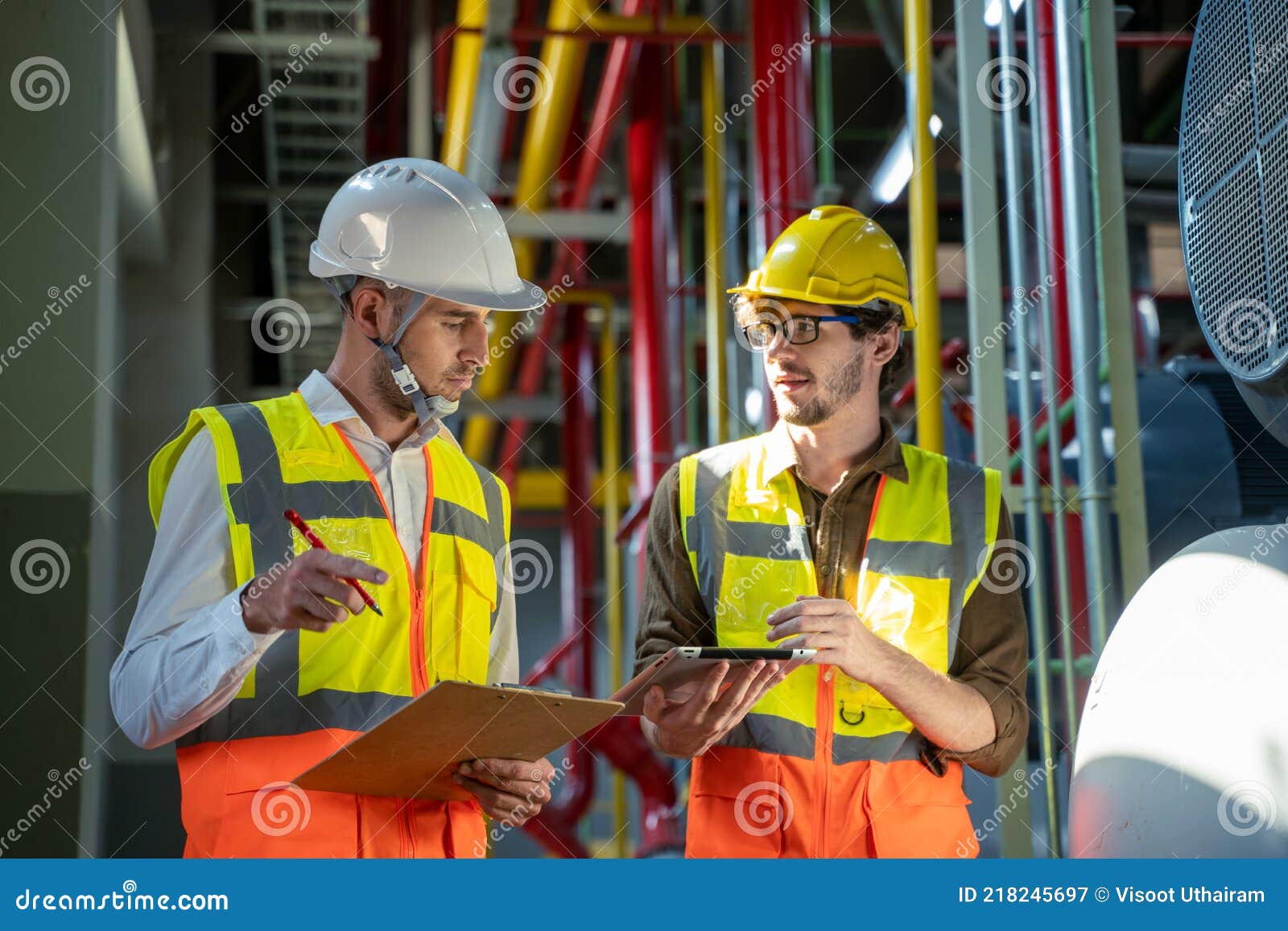 Engineer with Technical Worker Checking and Working at Industry Factory ...