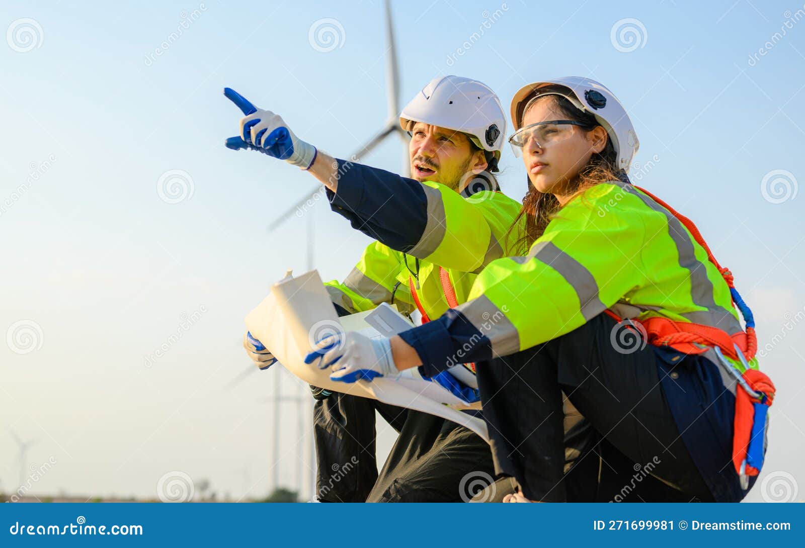 Engineer Technician with Safety Uniform Working at Wind Turbine Field ...