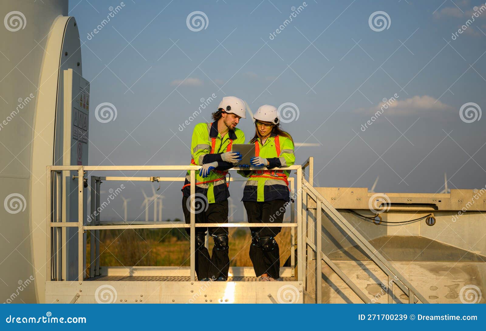 Engineer Technician with Safety Uniform Working at Wind Turbine Field ...