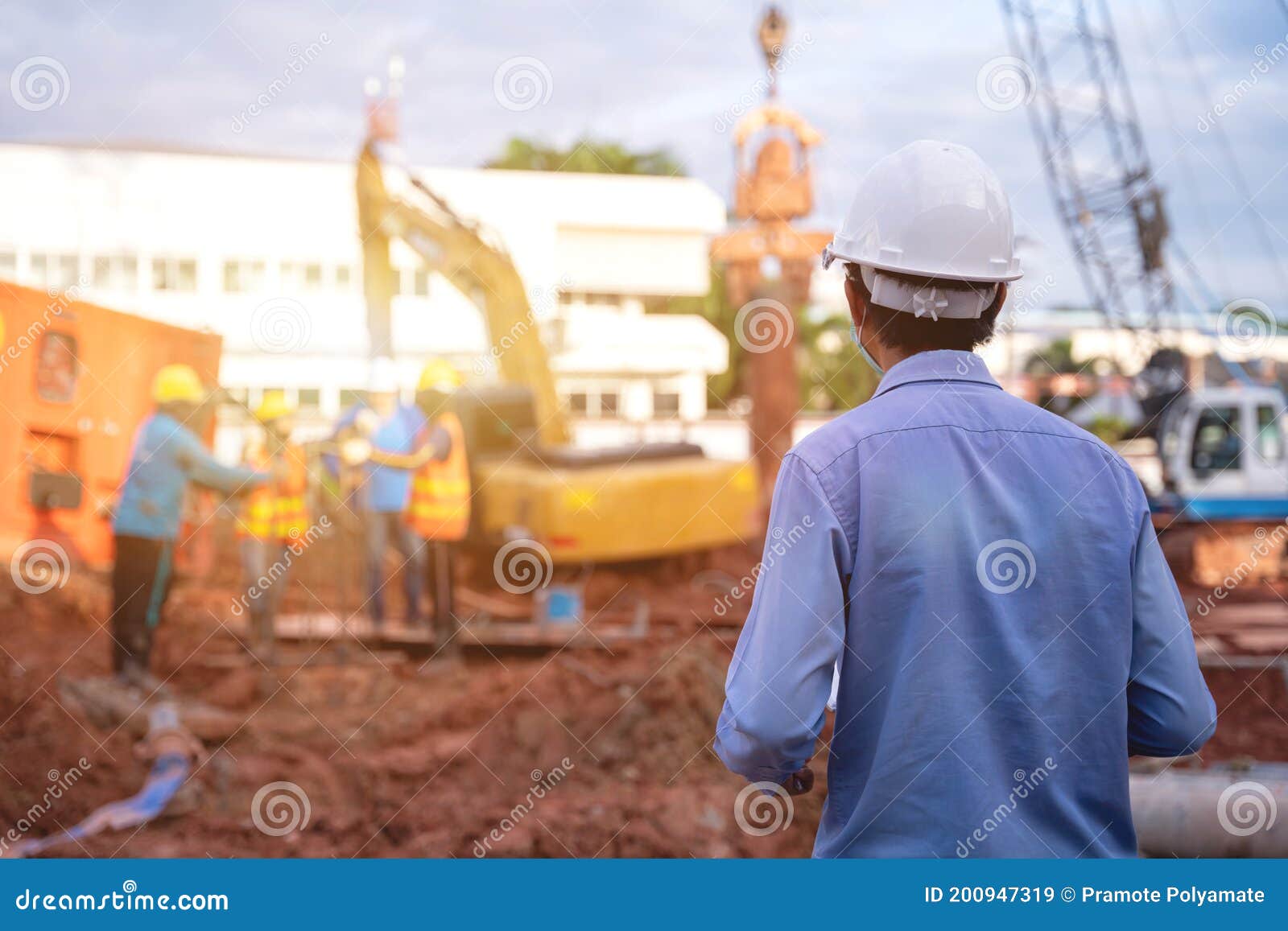 Engineer Technician Watching Team of Workers at Construction Site ...