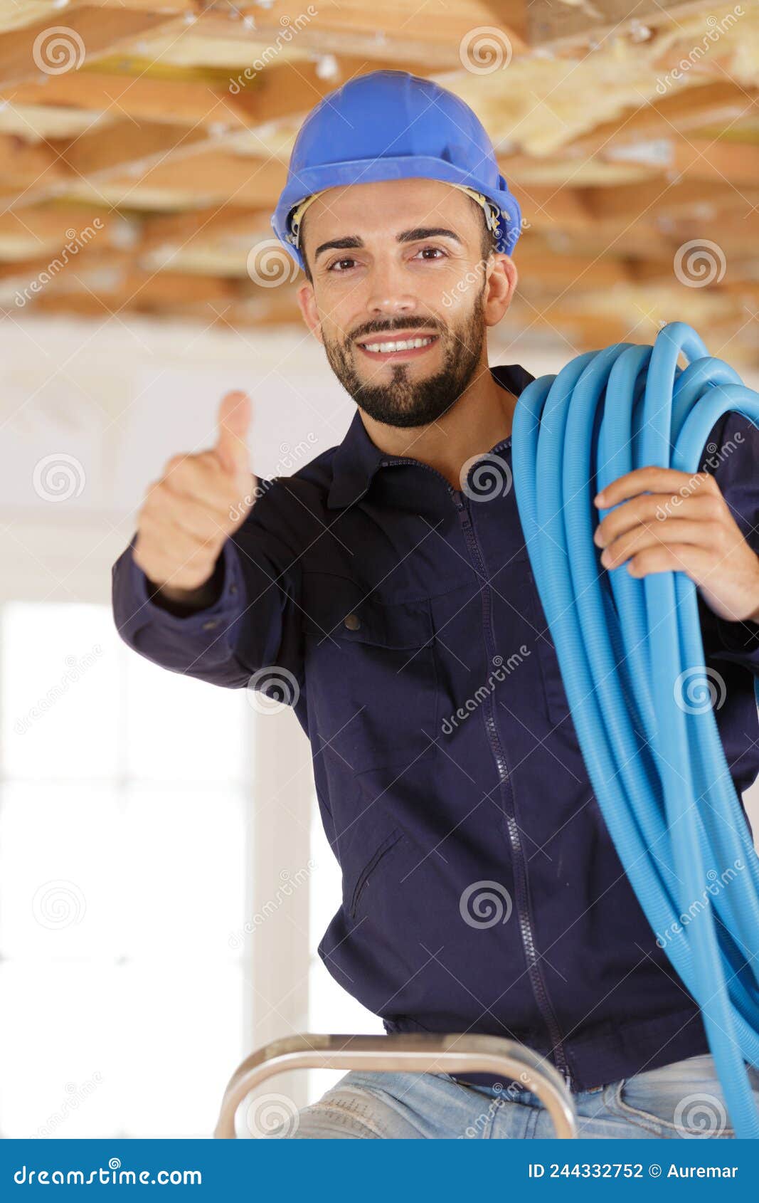 Engineer with thumbs up stock photo. Image of services - 244332752