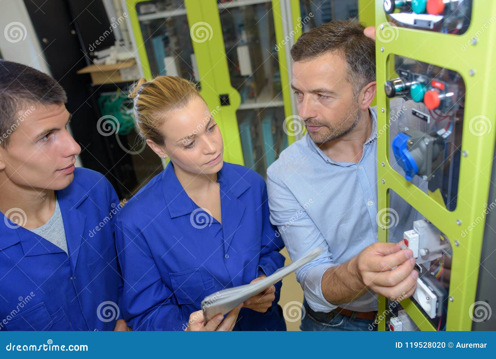 Engineer and Trainees Using Equipment in Factory Stock Photo - Image of ...