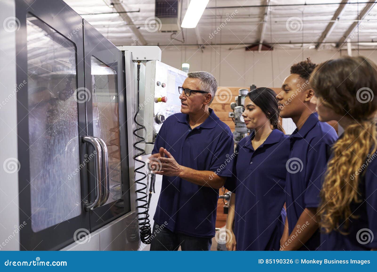 Engineer Training Apprentices on CNC Machine Stock Photo - Image of ...
