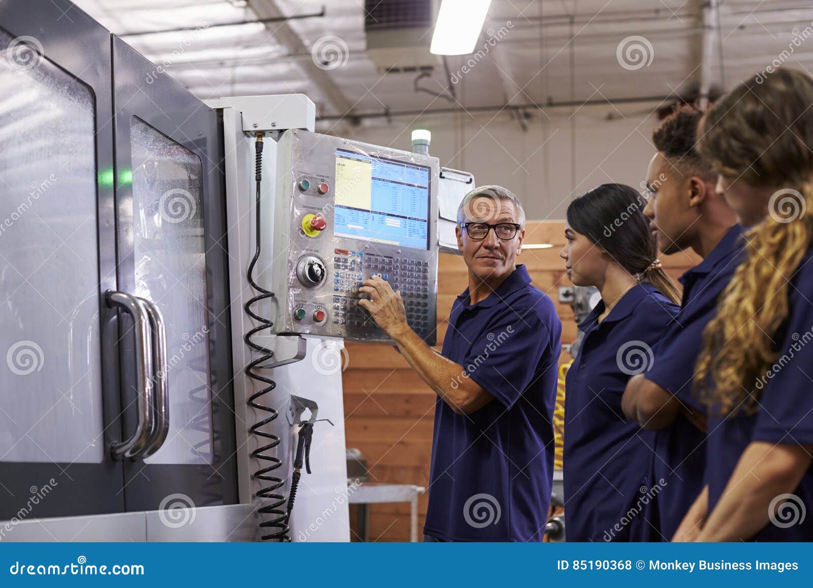 Engineer Training Apprentices on CNC Machine Stock Photo - Image of ...