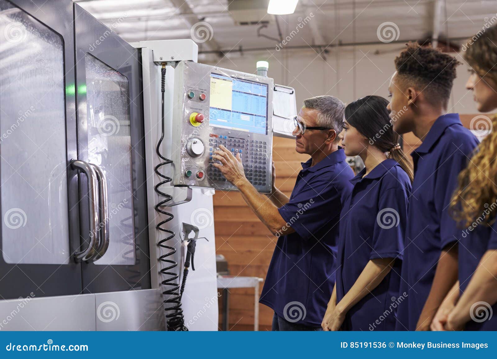 Engineer Training Apprentices on CNC Machine Stock Photo - Image of ...