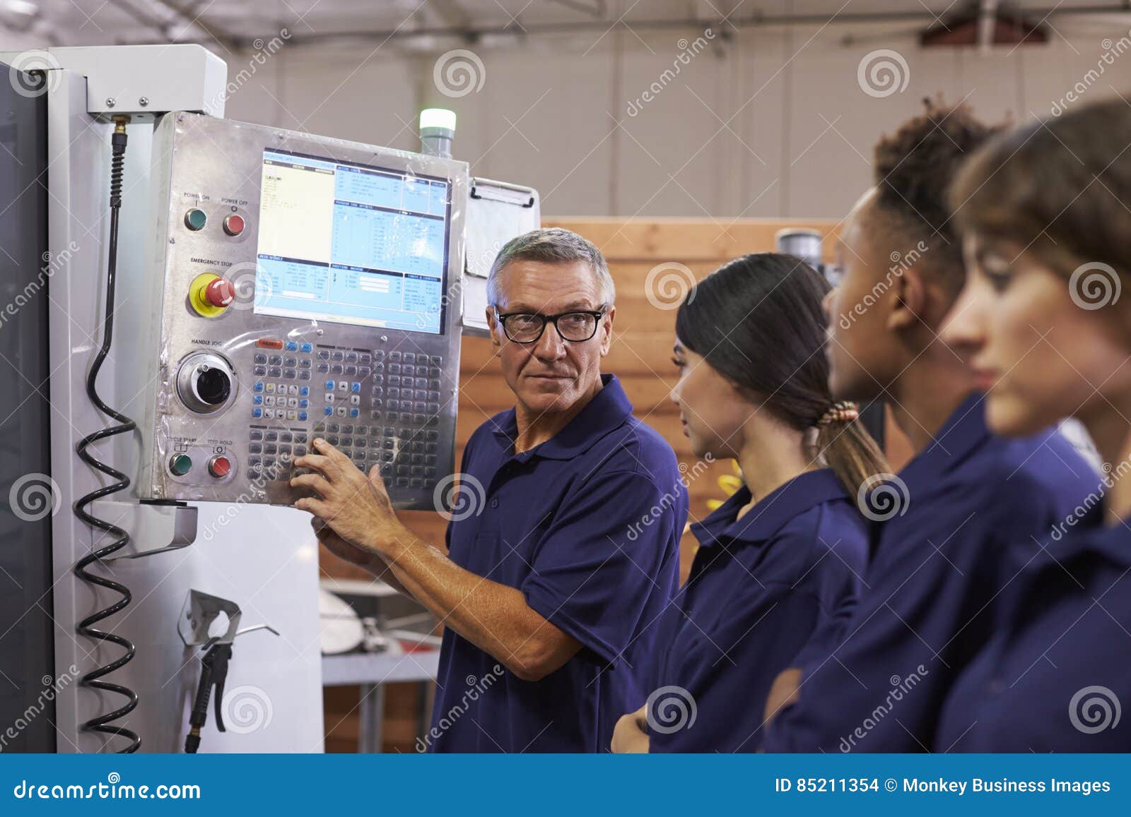 Engineer Training Apprentices on CNC Machine Stock Photo - Image of ...