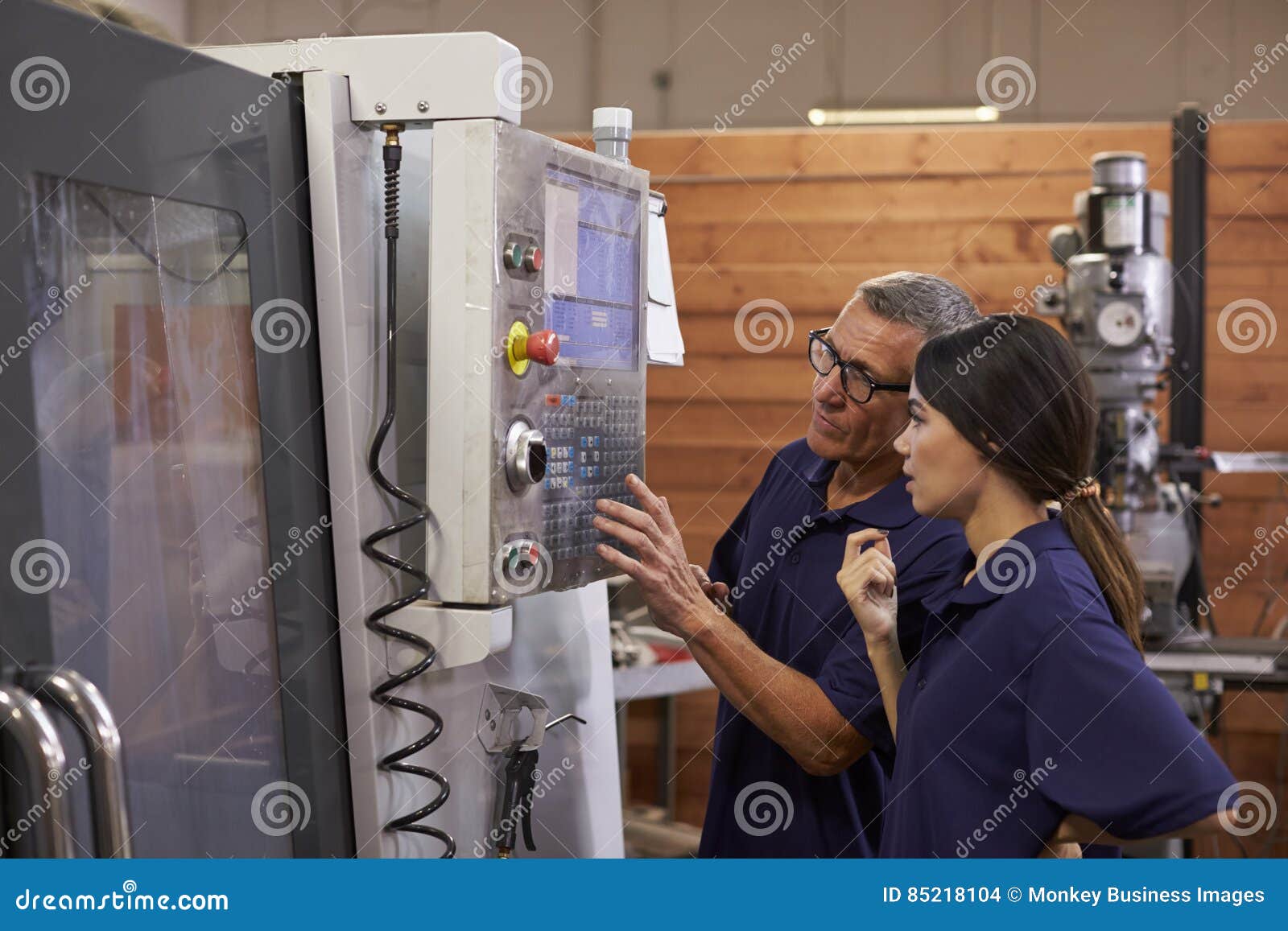 Engineer Training Female Apprentice on CNC Machine Stock Photo - Image ...