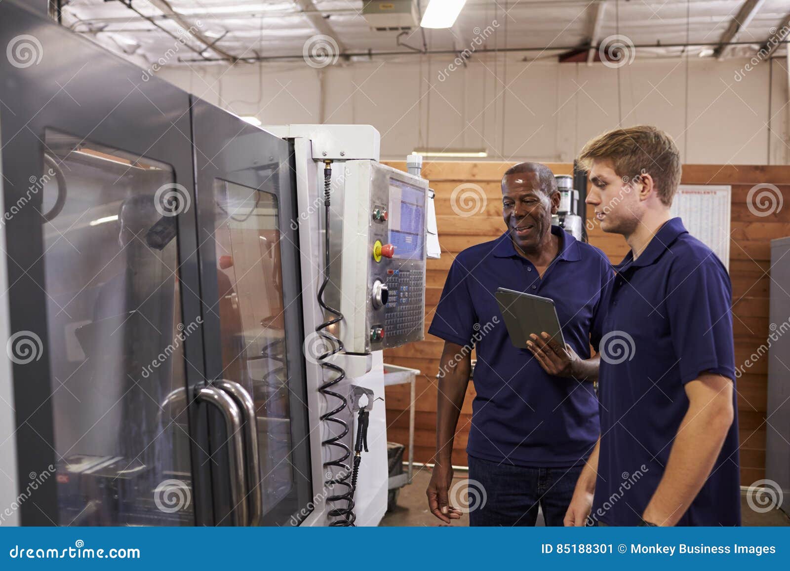 Engineer Training Male Apprentice on CNC Machine Stock Image - Image of ...
