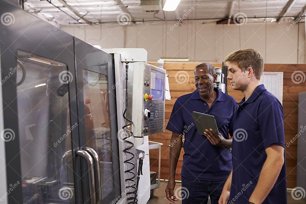Engineer Training Male Apprentice on CNC Machine Stock Image - Image of ...