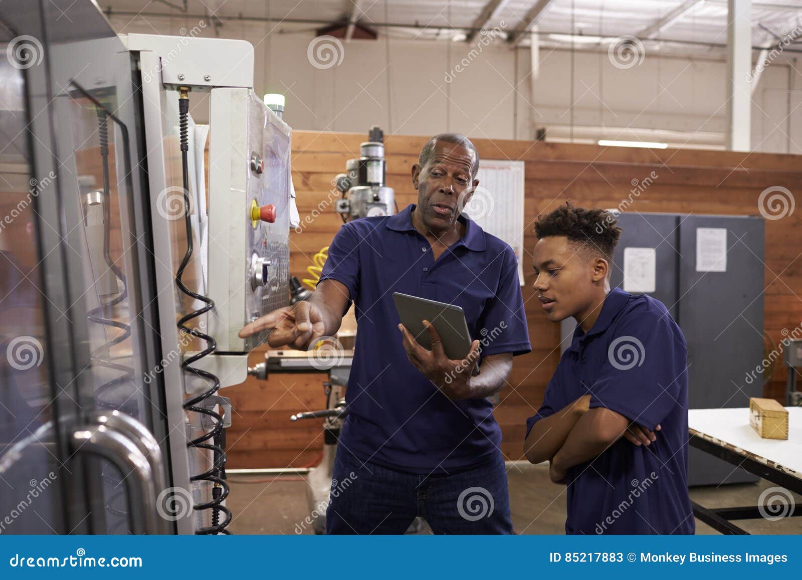 Engineer Training Young Male Apprentice on CNC Machine Stock Image ...