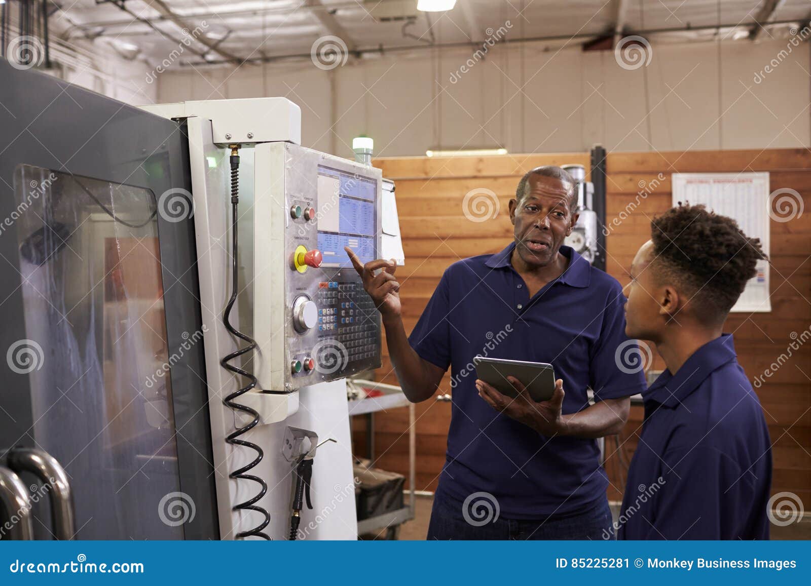 Engineer Training Young Male Apprentice on CNC Machine Stock Image ...