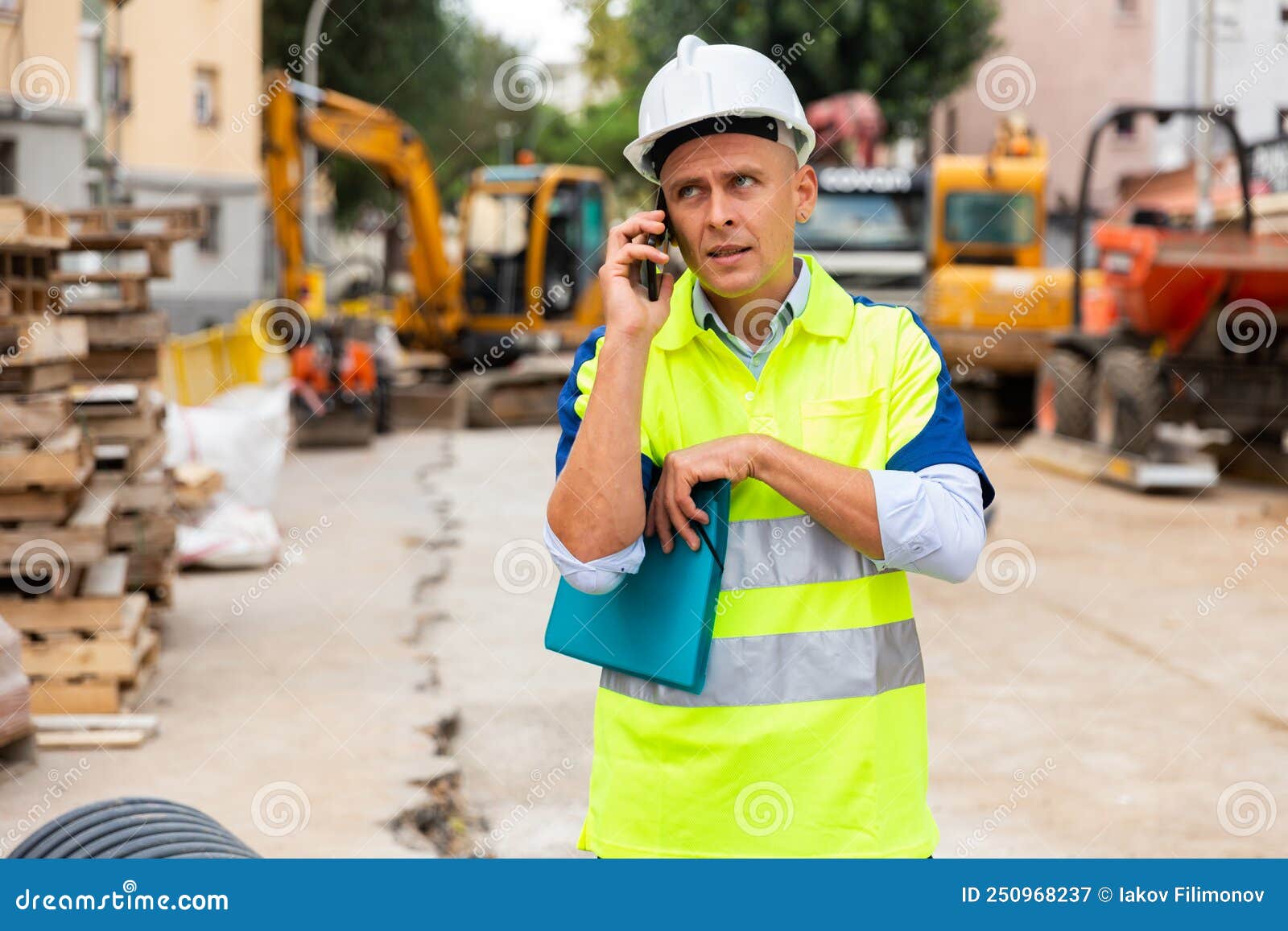 Foreman Talking on Phone in Construction Area Stock Image - Image of ...