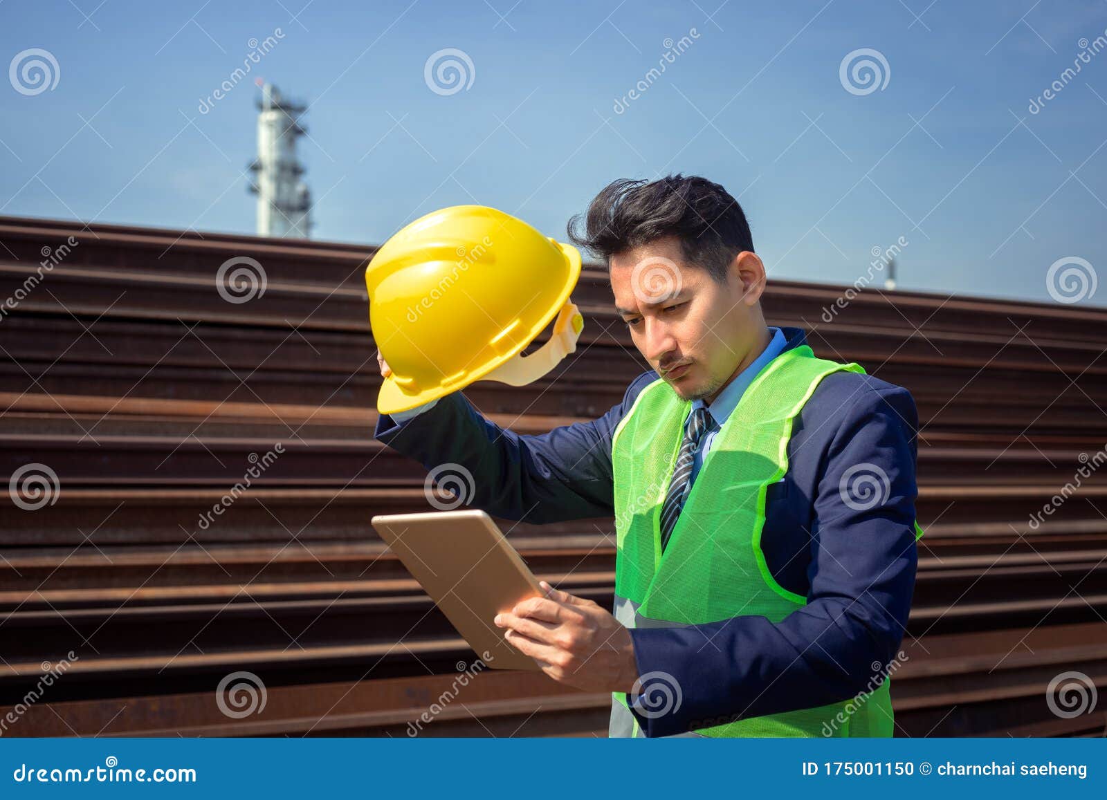 Engineer Use Tablet for Test and Checking at Industry in Midday and Hot ...