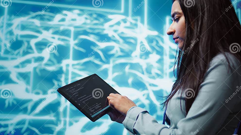 Engineer Uses Tablet and AI Deep Neural Networks To Solve Tasks Stock ...