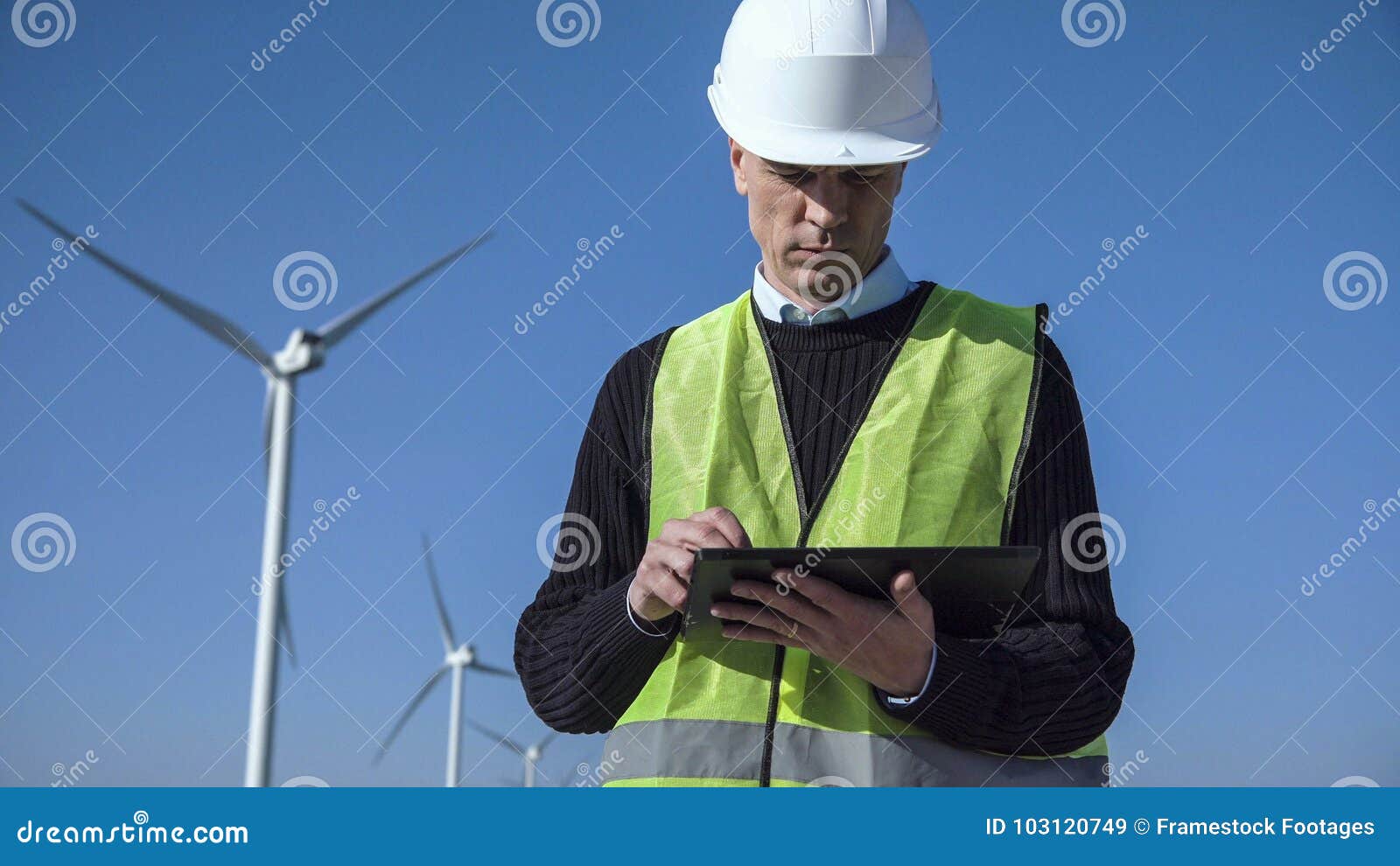Engineer Using Digital Tablet Against Wind Turbine Stock Image - Image ...