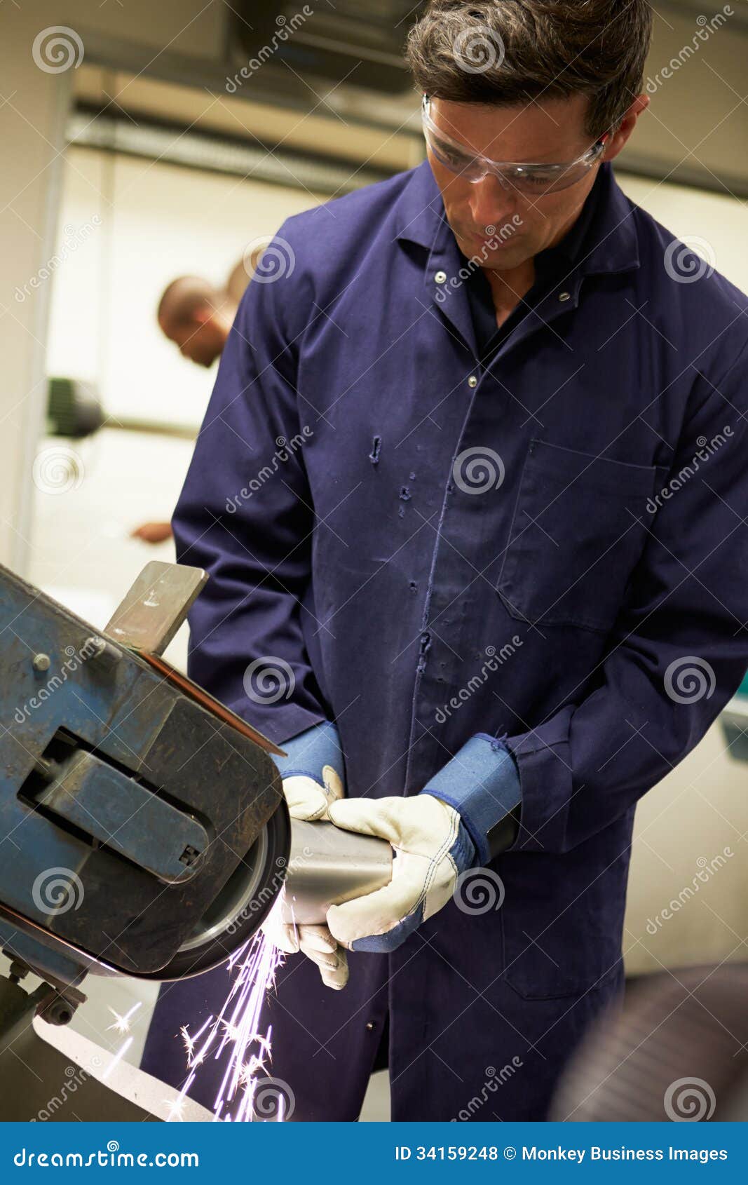 Engineer Using Grinding Machine in Factory Stock Photo - Image of ...