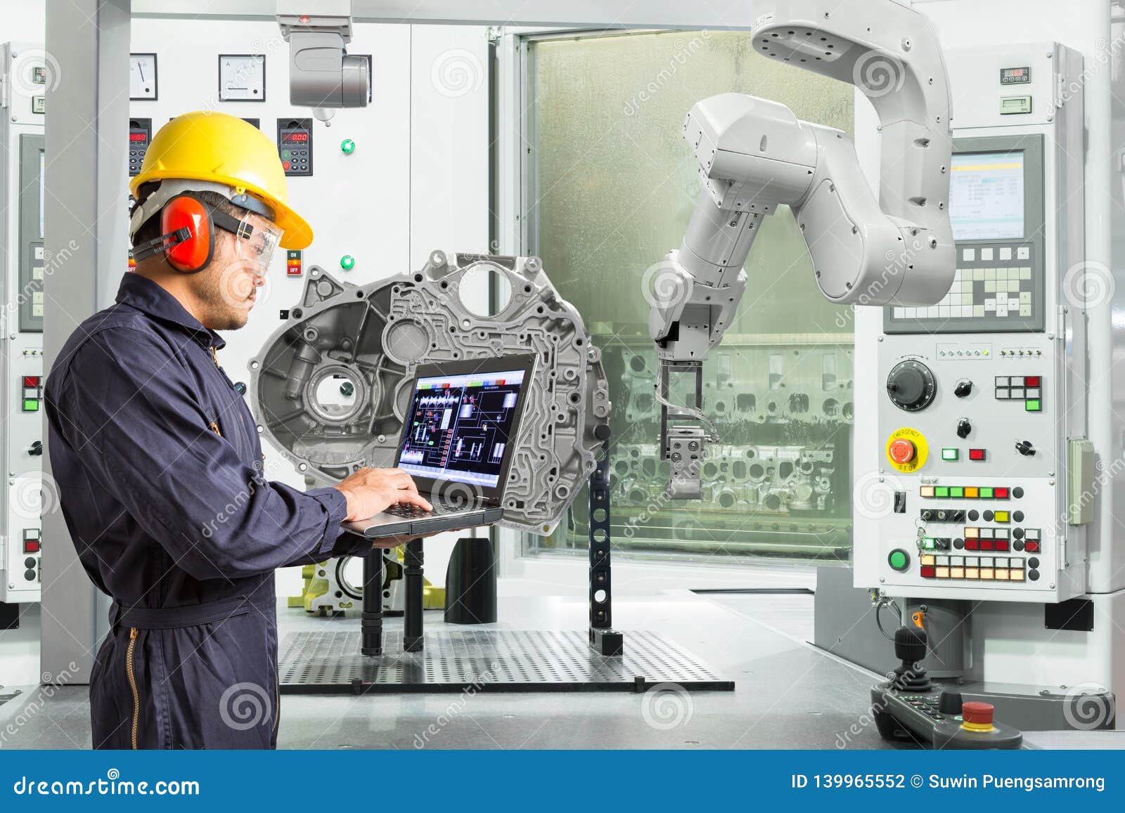 Engineer Using Laptop Computer Control Automatic Robotic Hand With Cnc