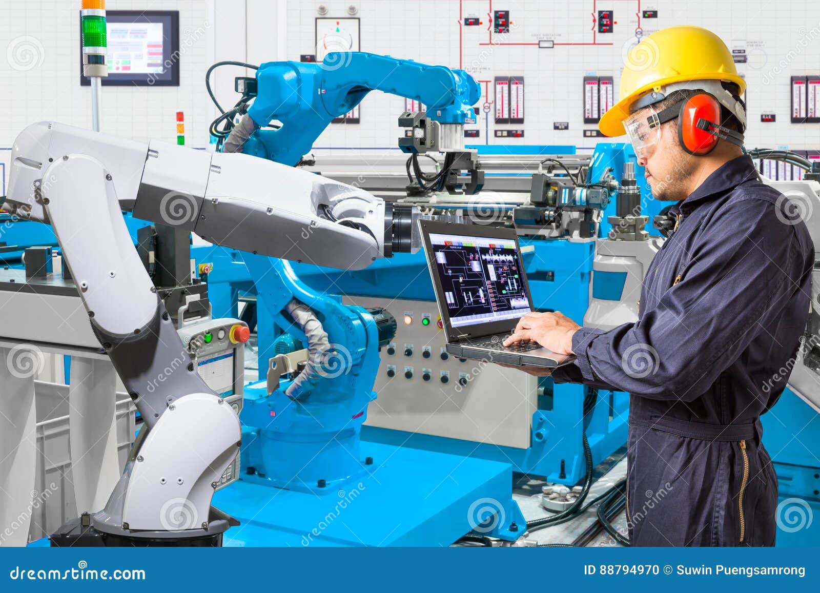 Engineer Using Laptop Computer for Maintenance Automatic Robotic Stock ...