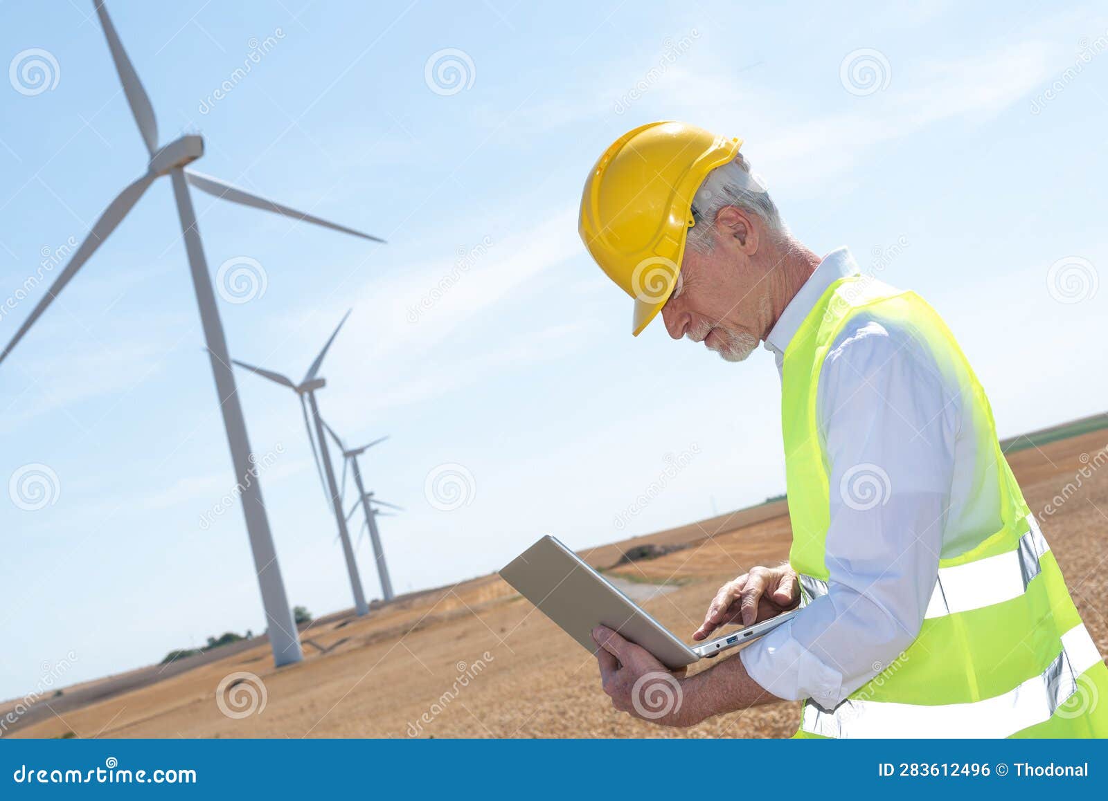 Engineer Using Laptop for Wind Turbine Inspection Stock Photo - Image ...