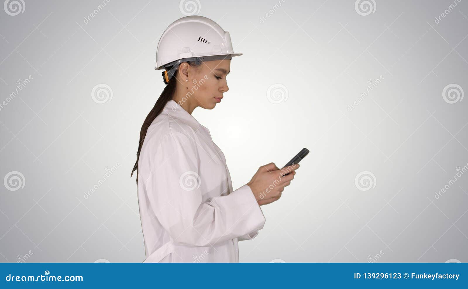 Engineer Using Mobile Phone Texting while Walking on Gradient ...