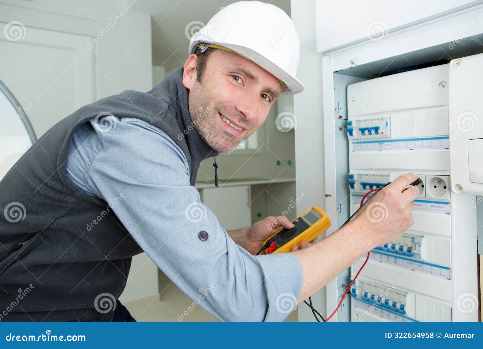 Engineer Using Multi-meter To Test Fusebox Stock Photo - Image of ...