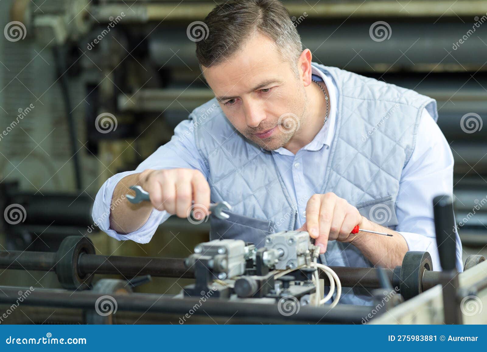 Engineer Using Screwdriver and Spanner To Work in Machine Stock Image ...