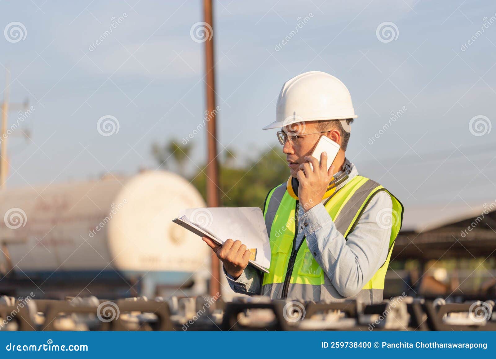 Engineer Using Smartphone with Holding Clipboard Checklist in ...