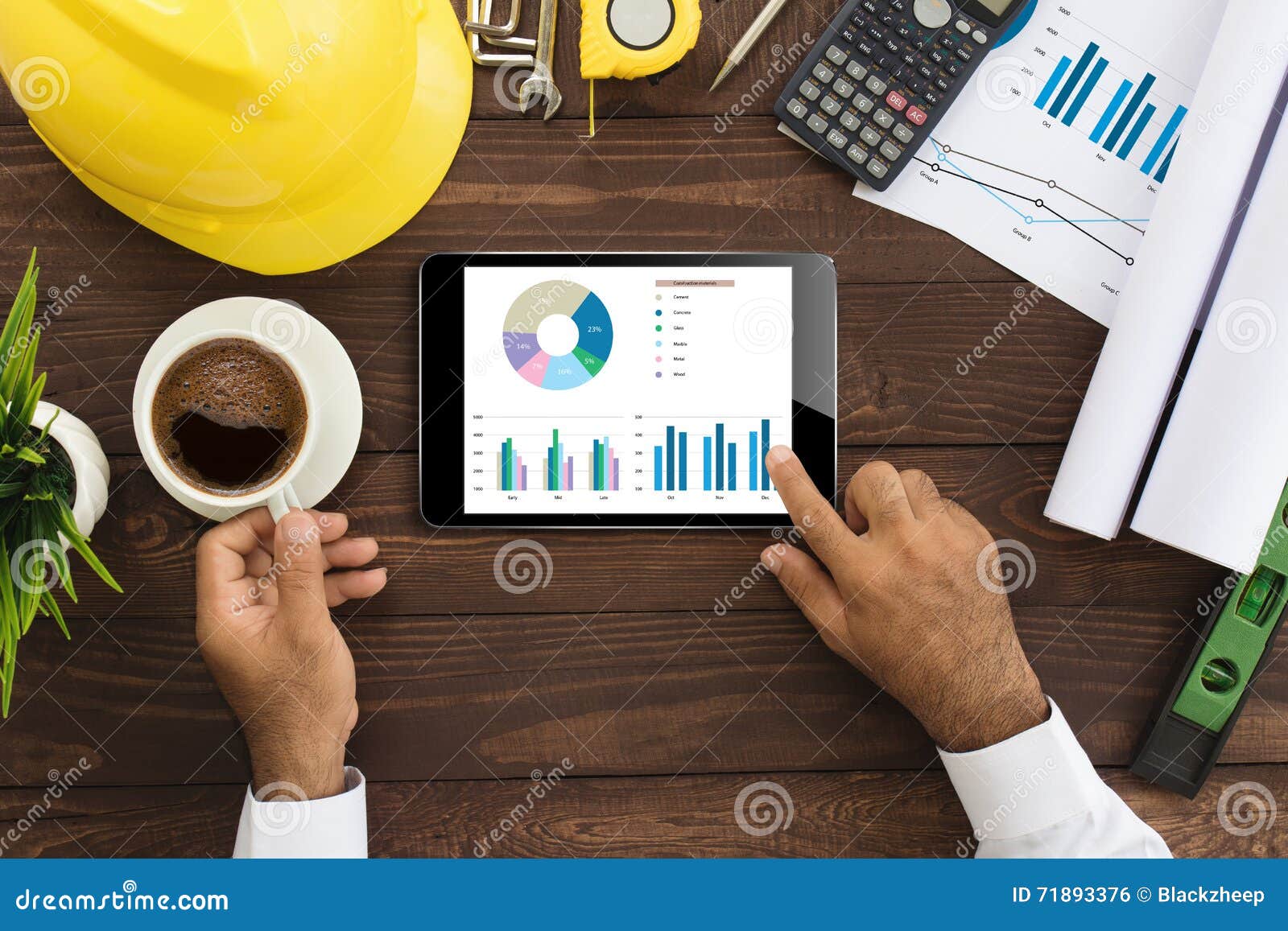 Engineer Using Tablet Checking Business Graph On Table Stock ...