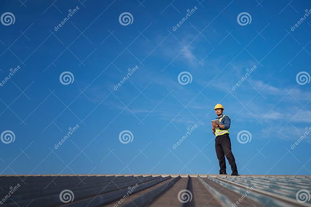 Engineer Using Tablet To Inspect Work at Job Site Stock Photo - Image ...