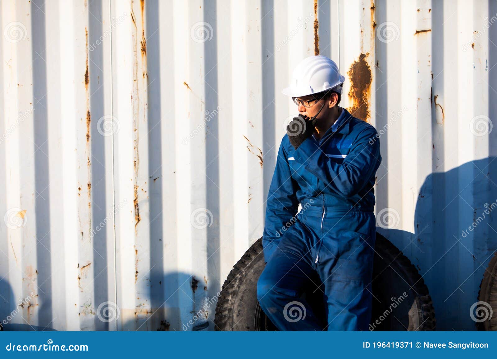 Engineer Using Walkie-talkie in Shipping Yard. Foreman Control Loading ...