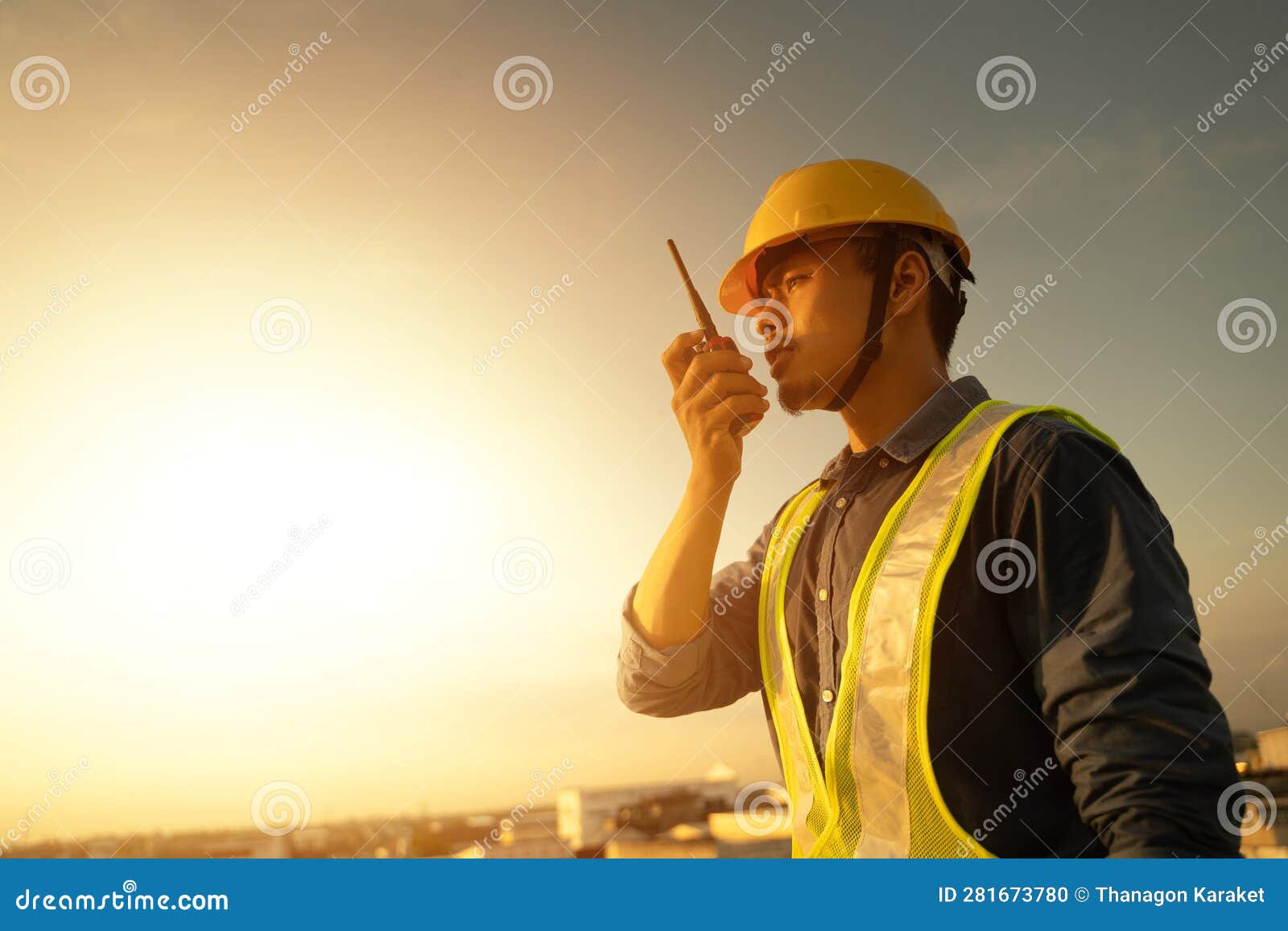 Engineer Using Walkie Talkie and Talking about Work Construction Site ...