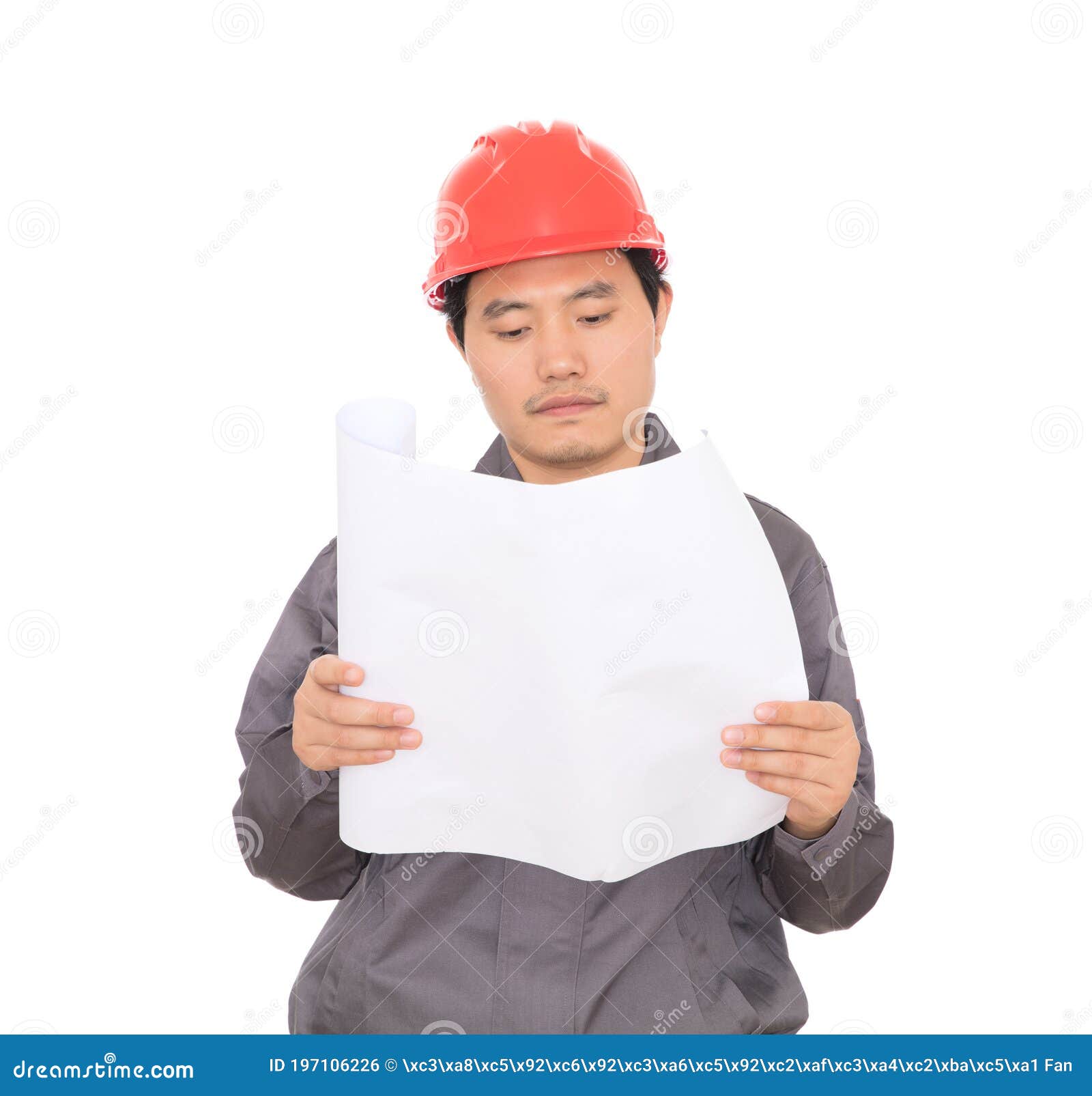 An Engineer Wearing a Hard Hat is Looking at the Drawings Stock Photo ...