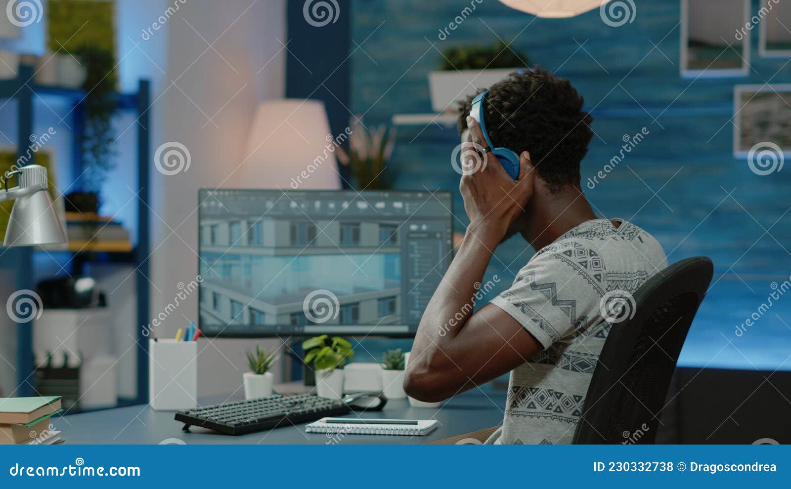Engineer Wearing Headphones and Designing Building Model Stock Photo ...