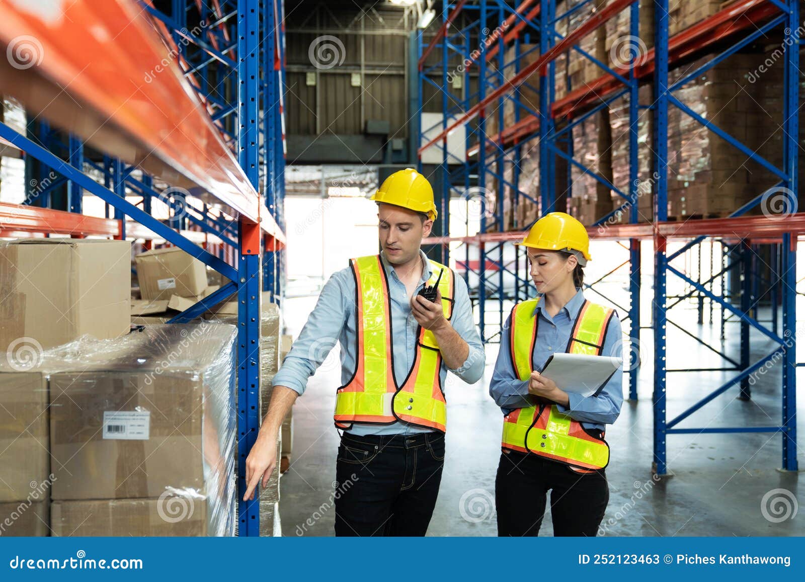 Engineer Wearing Safety Vest Controlling Machine Working Talking with ...